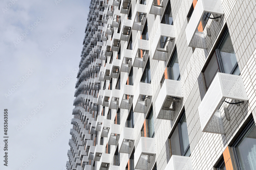 The facade of a new multi-storey residential building with windows and ...
