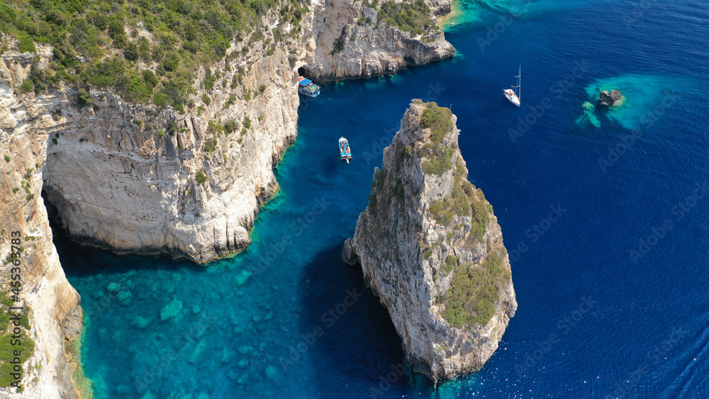 Aerial drone photo of iconic Ortholithos and azure caves with deep ...