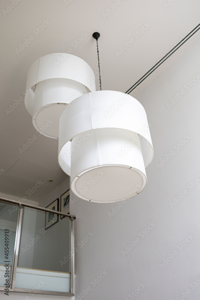 Ceiling lamp hanging overhead on ceiling Stock Photo | Adobe Stock