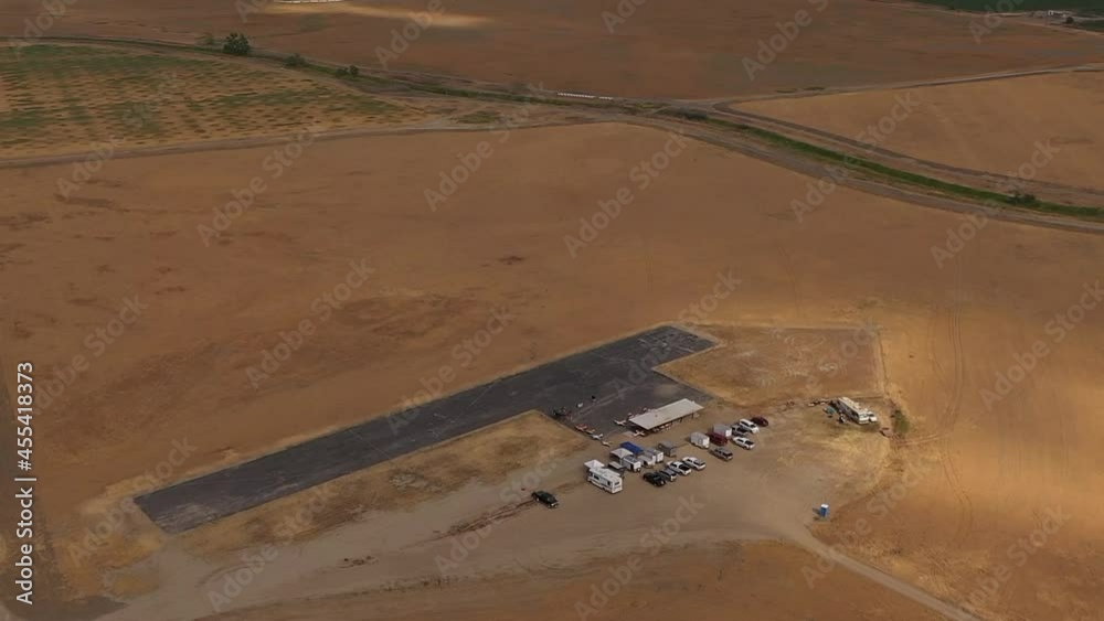 Birds eye view of a model aircraft. filmed with a drone paning left to ...