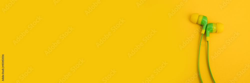 headphones on the yellow backgrounds. Stock Photo | Adobe Stock