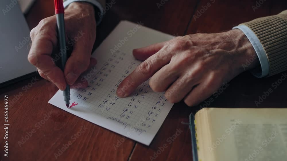 Male teacher checking answers on test form and giving highest A mark ...