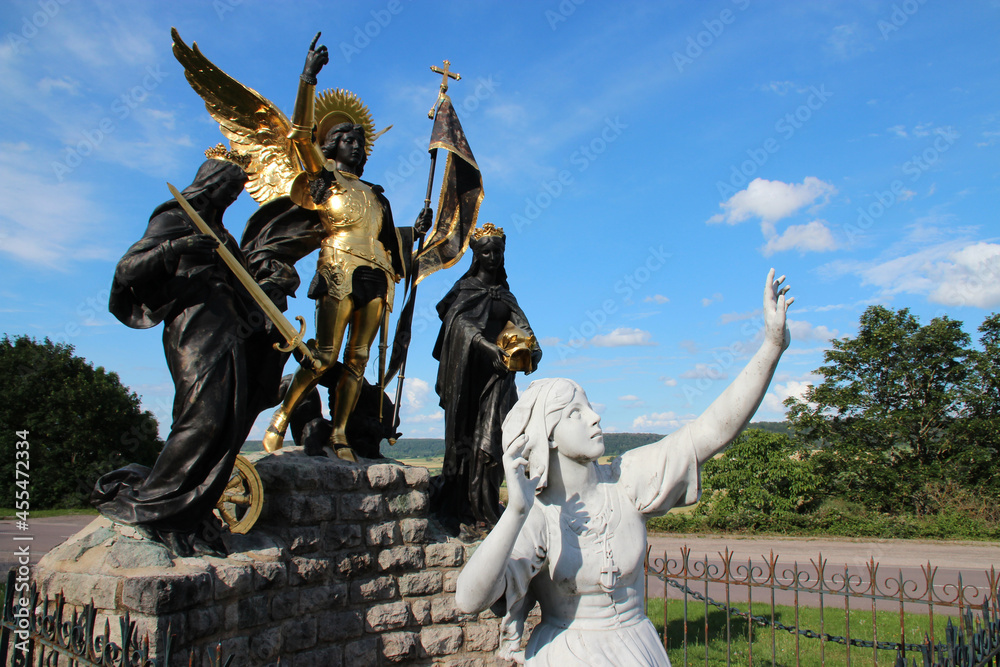 statue of joan of arc (?) with holy characters in domremy-la-pucelle in ...