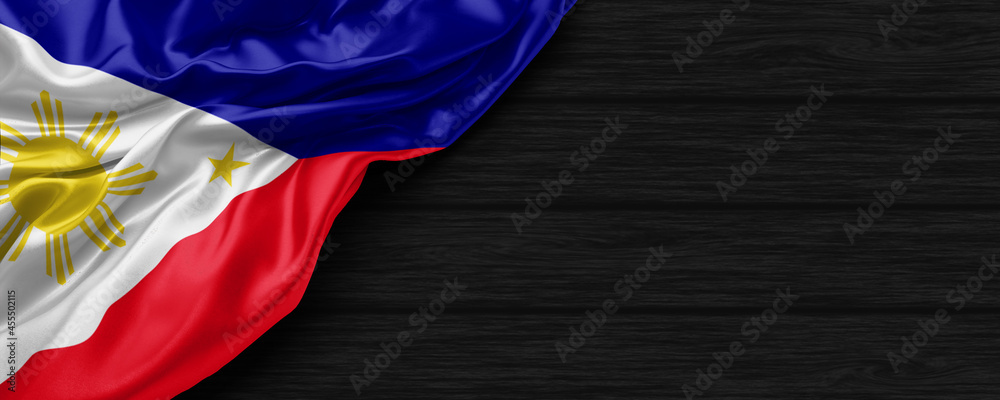 Close Up of Philippines flag on the black wooden background 3D render ...