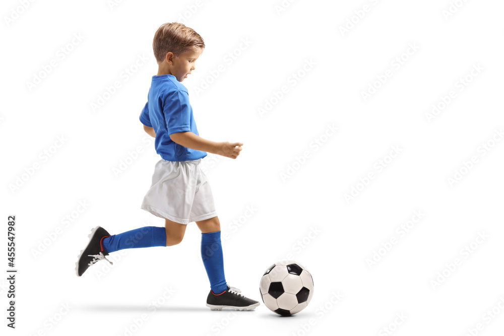 Full length profile shot of a boy running with soccer ball Stock Photo ...