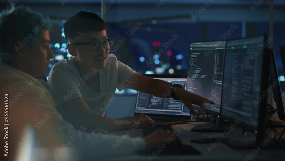 Teamwork In Diverse Office at Night: Project Manager Talks with ...