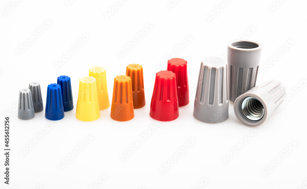 Different sizes and colors of Wire nut connectors on white background ...