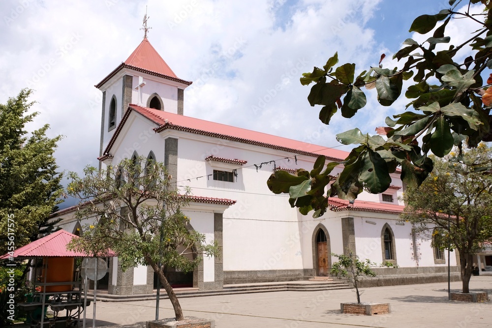 A view of the white and red Motael Church in the city centre of Dili ...