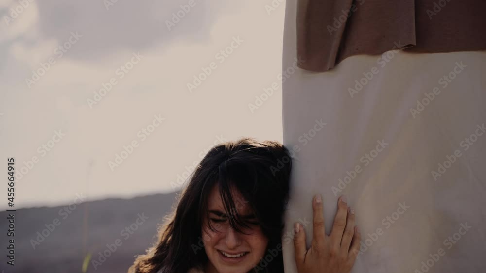 Mary mourns the death of Jesus at his feet. Jesus is crucified on the cross. Wind is blowing ...