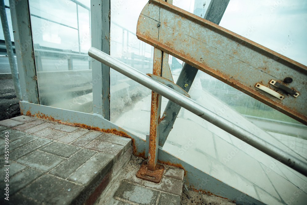 rusty handrails of pedestrian bridge supports. metal elements of the ...
