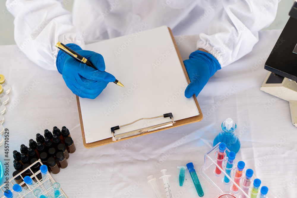 Professional health care researcher working in medical science lab ...