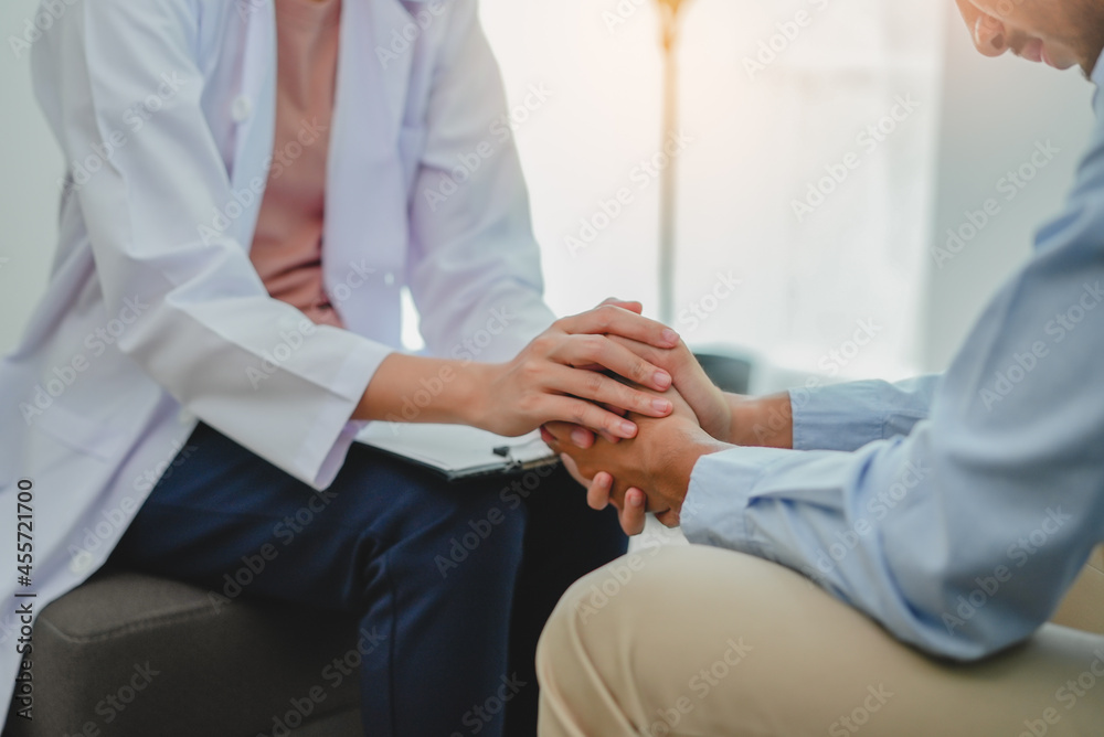 psychologist touching patient hands during talking therapy stressed ...
