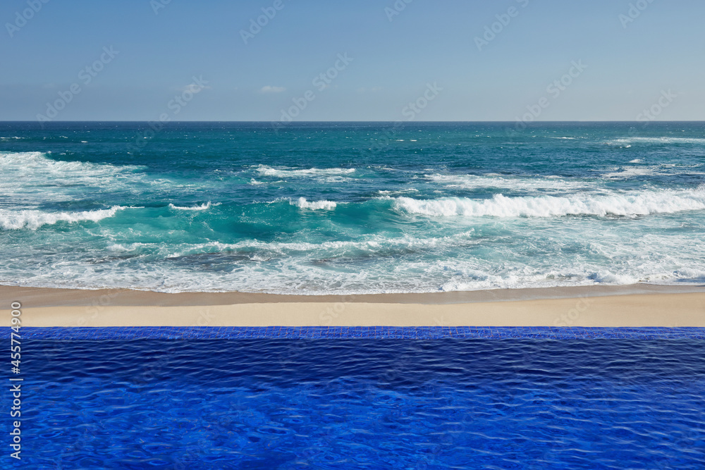 Architecture image of infinity pool on beach and ocean Stock Photo ...
