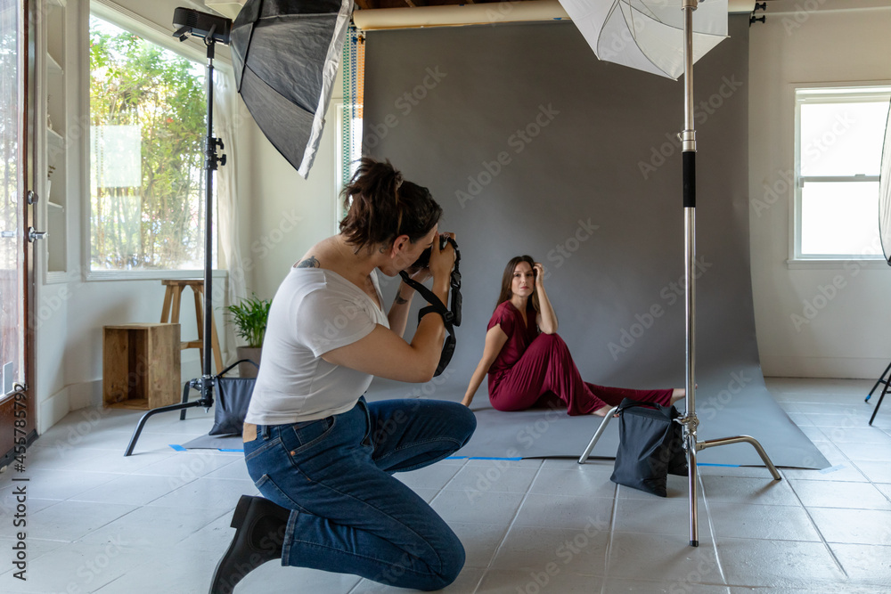 Female Photographer Shoots Model Stock Photo | Adobe Stock