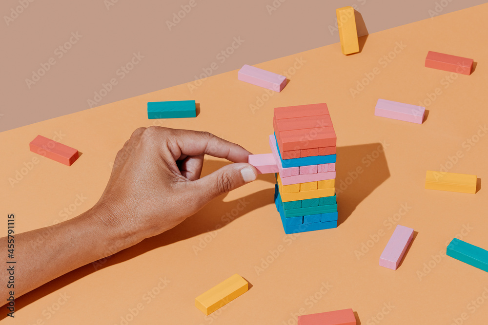 man playing with building blocks Stock Photo | Adobe Stock