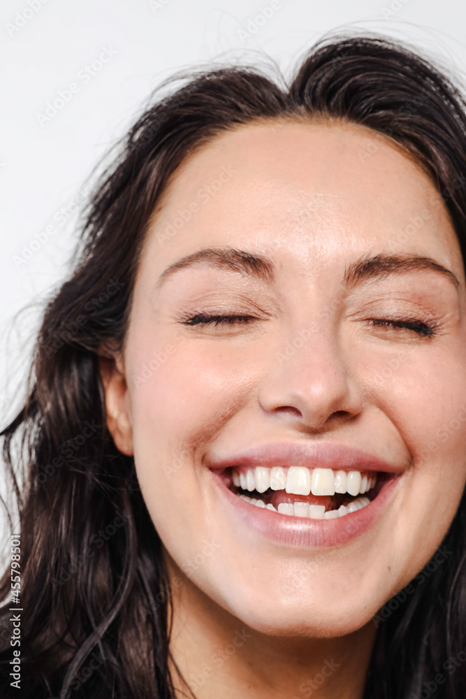 Beautiful young model with natural makeup laughing Stock Photo | Adobe ...