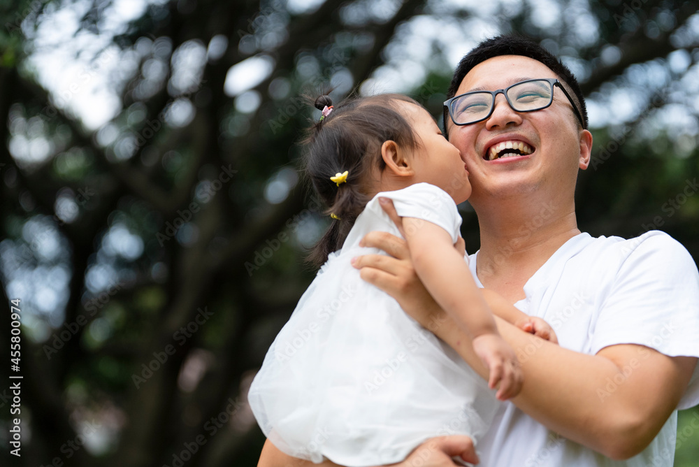 happy asian father holding baby girl laughing in the park Stock Photo ...