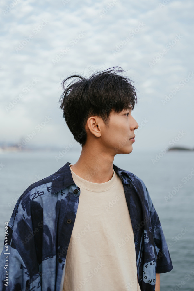 Portrait of an Asian man's profile face by the sea. Stock Photo | Adobe ...