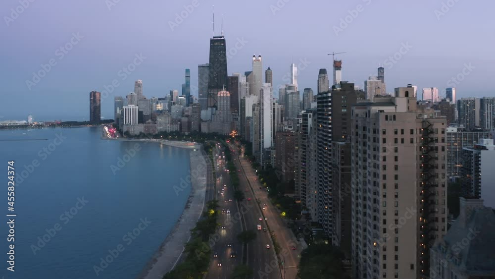 4K aerial night scene Chicago Downtown at dusk with purple blue sunset ...