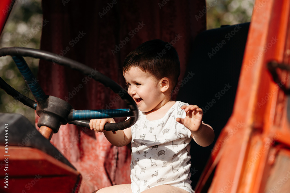 Happy boy in tractor cabin Stock Photo | Adobe Stock