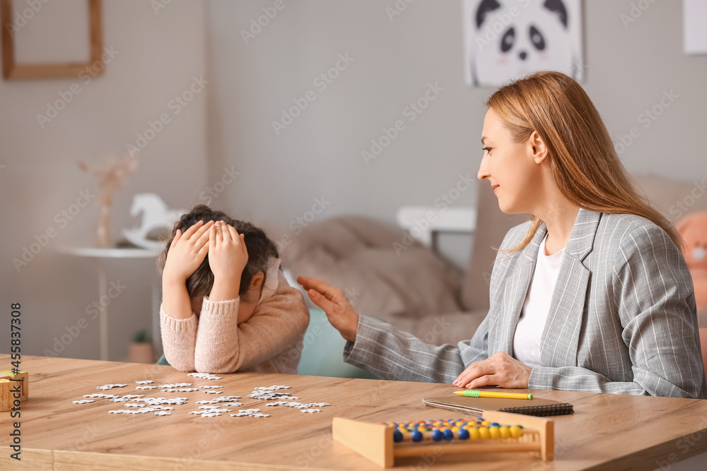 Stressed little girl with autistic disorder at child psychologist's ...