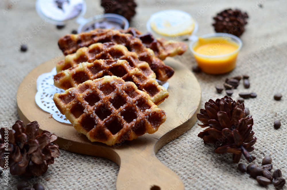Croissant Waffle or croffle with chocolate sauce and cheese with wood ...