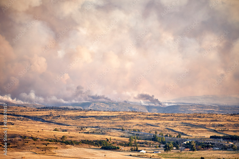 Dark and dense smoke clouds from a fire in Spain. Close-up of a large ...