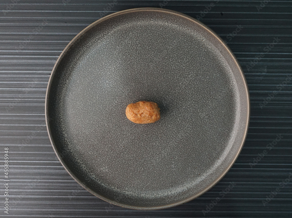 deep fried mini hot dog sausage luncheon meat with spicy sauce on dark ...