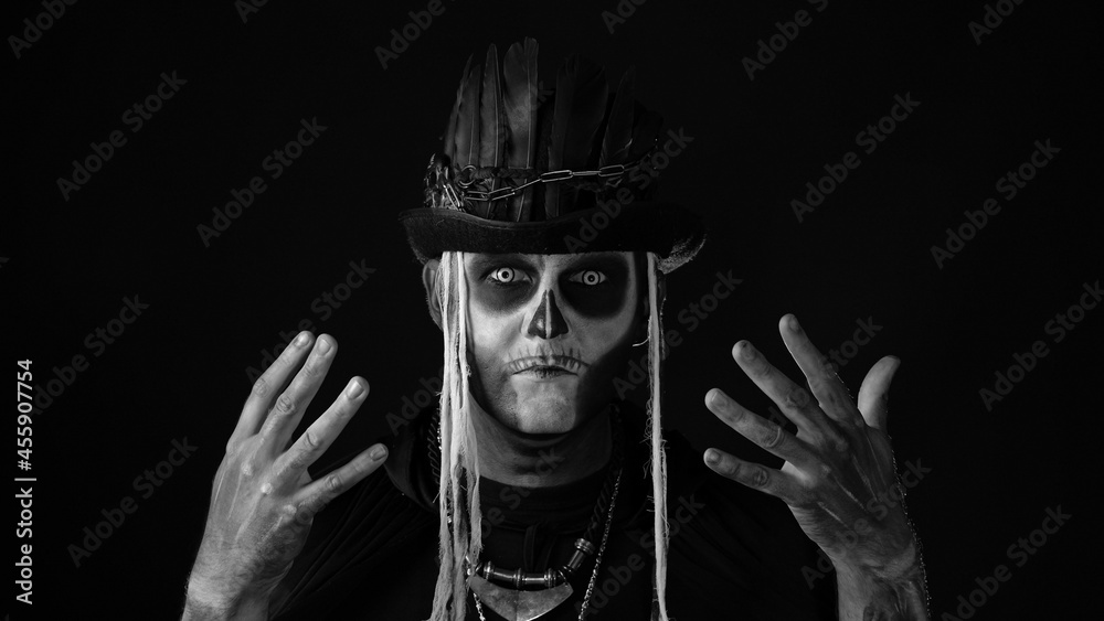 Man with horrible halloween skeleton makeup in costume with top-hat ...