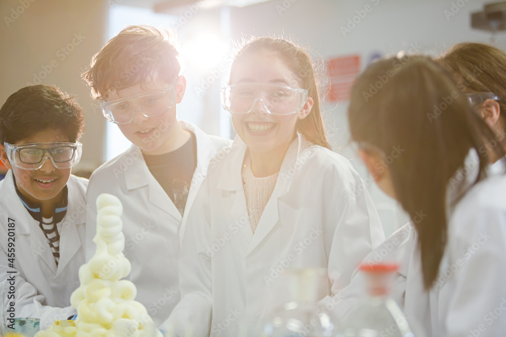 Surprised students conducting scientific experiment, watching chemical ...