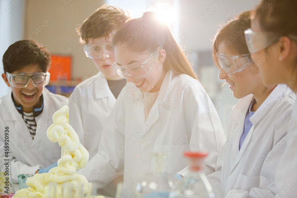 Surprised students conducting scientific experiment, watching chemical ...
