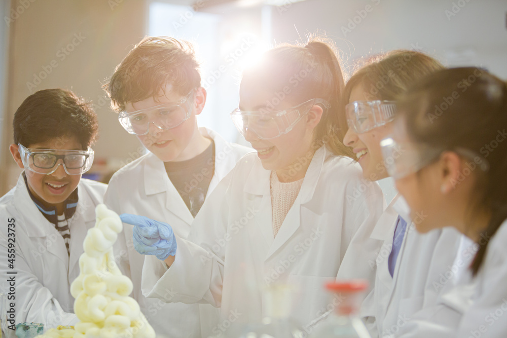 Surprised students conducting scientific experiment, watching chemical ...