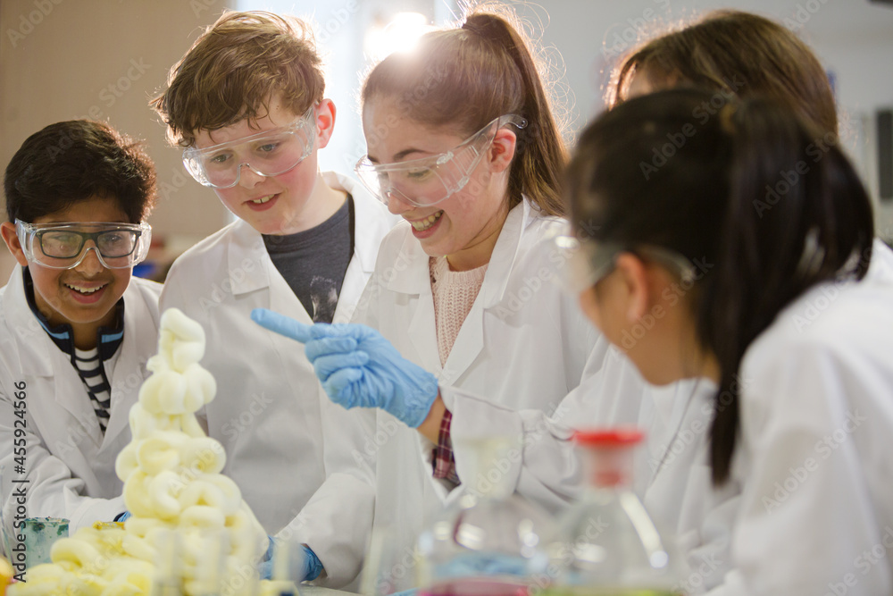 Surprised students conducting scientific experiment, watching chemical ...