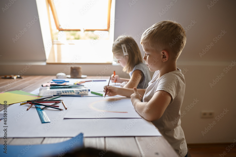 Two children drawing with pencils and markers Stock Photo | Adobe Stock