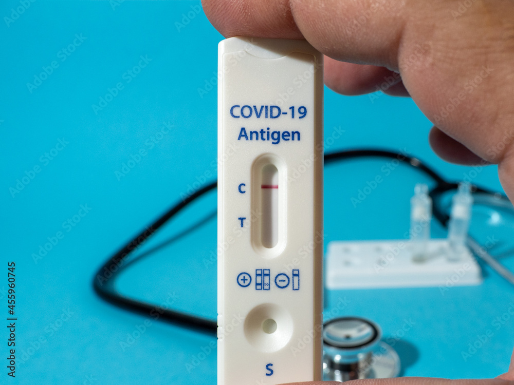 Negative test result using COVID-19 rapid testing device. Stock Photo ...