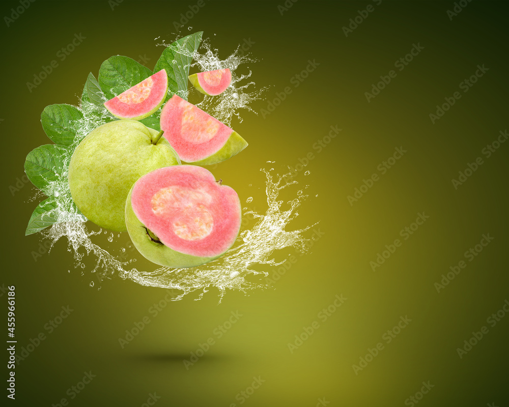 Water splash on fresh Guava fruit with leaves isolated on green ...