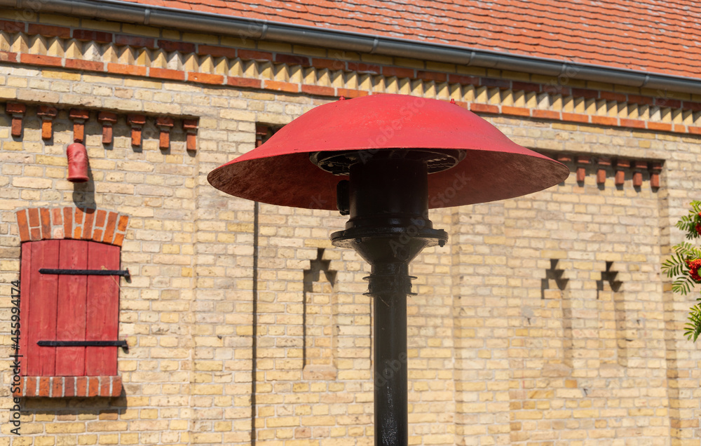 Old fire siren in front of the building of he fire department Stock ...