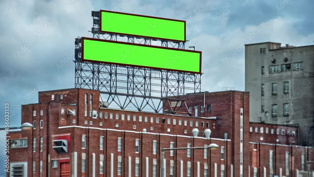 Large Billboard Green Screen On Building Top. A large billboard with a ...