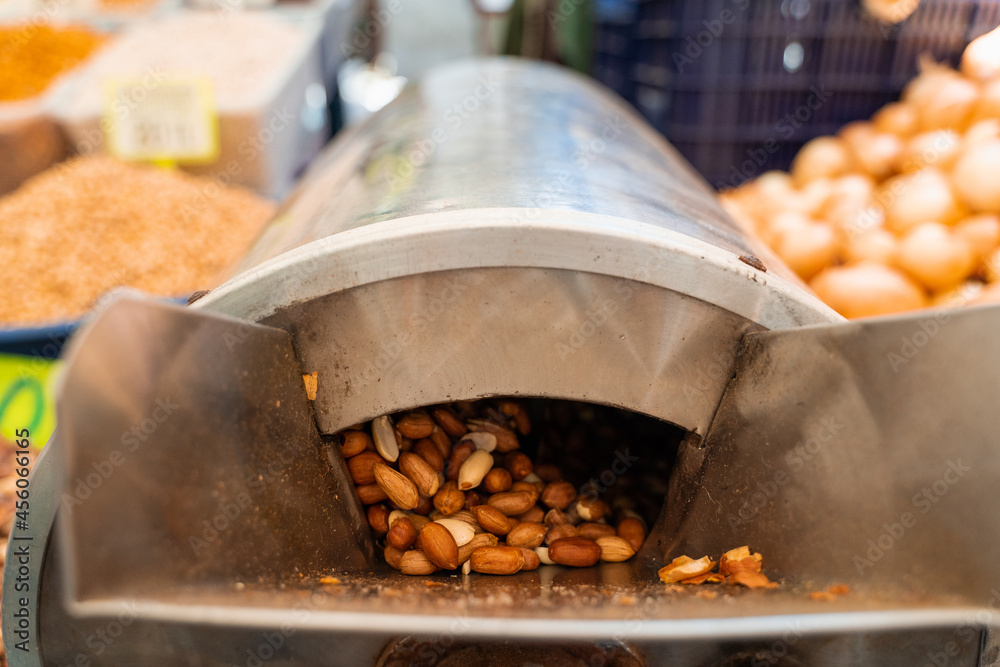 Roasting and blanching peanuts. Process of peeling peanuts in machine ...