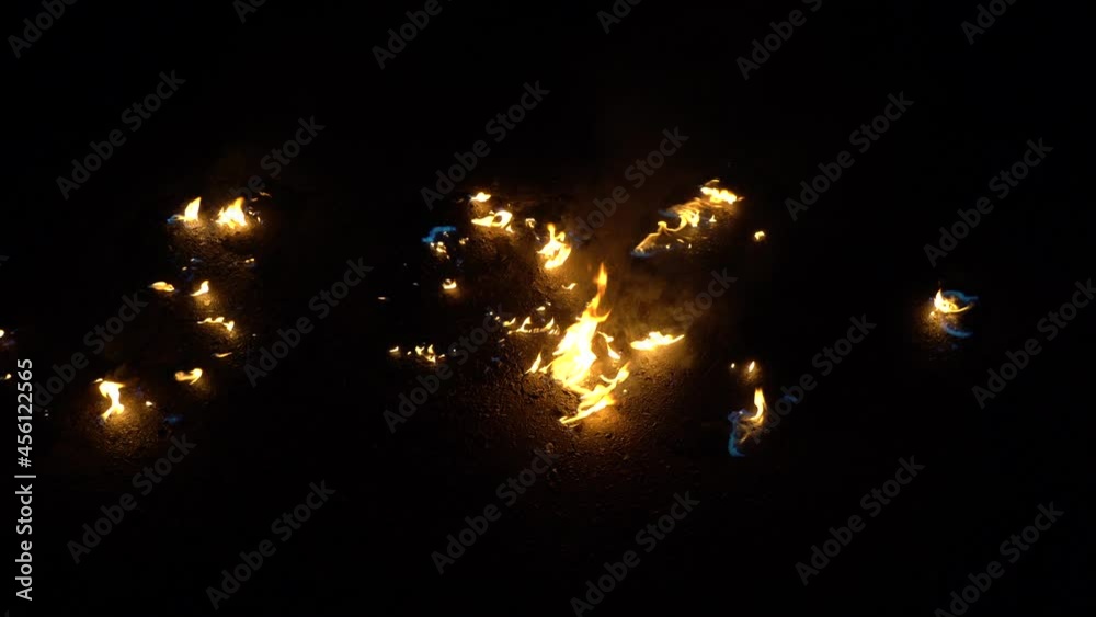 Video of fire and flame.A fire pit, burning gas or gasoline burns with ...