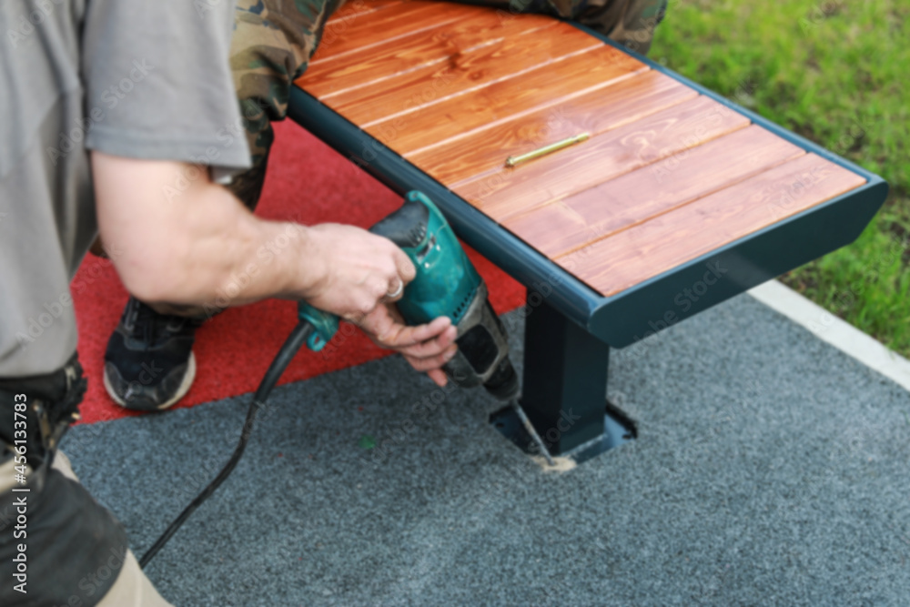 Blur image of installation of benches on the playground. Bench and ...
