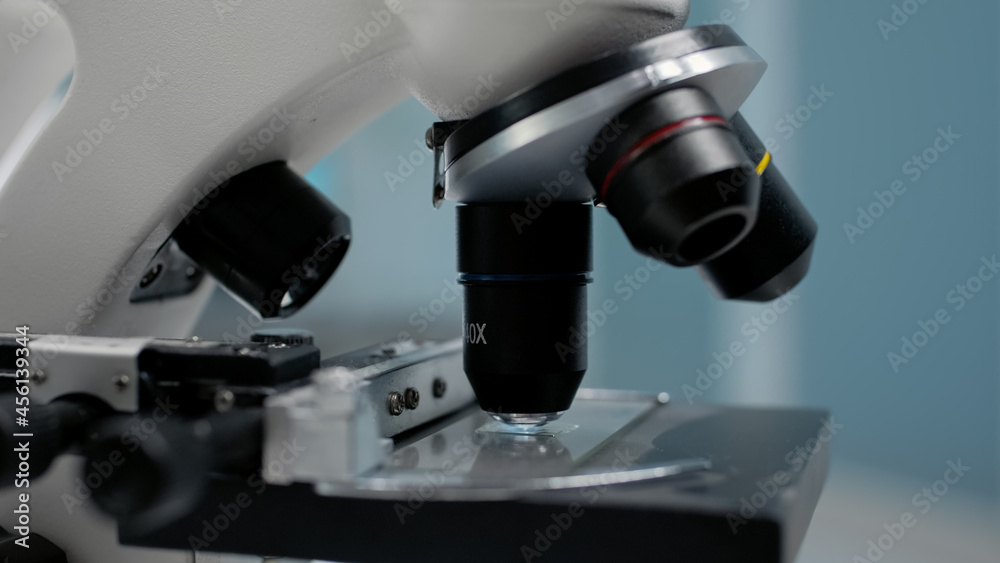 Close up of microscopic sample glass tray in laboratory. Microscope for ...