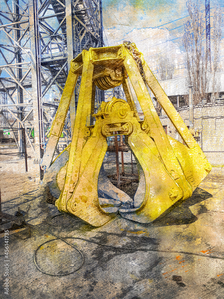 Yellow multi-jaw mechanical grapple. Load-handling device on an open ...