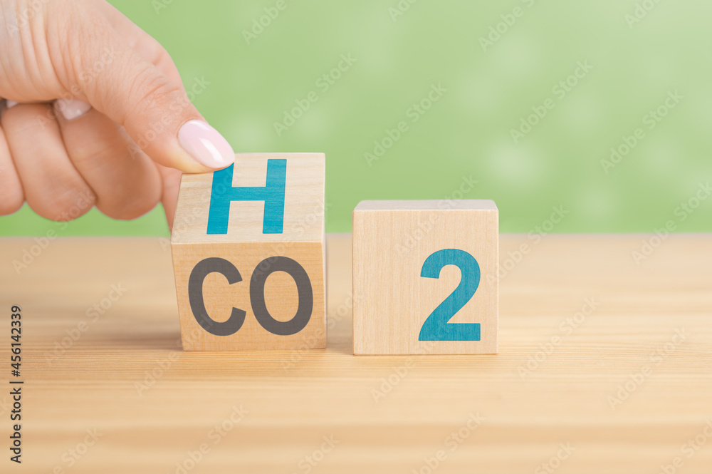 Switching to hydrogen H2. Change to fuel cell vehicles. Hand flips cube ...