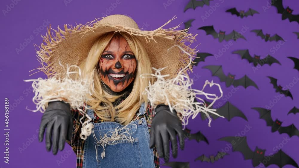 Scary bright alive fun young woman with Halloween makeup mask wears ...