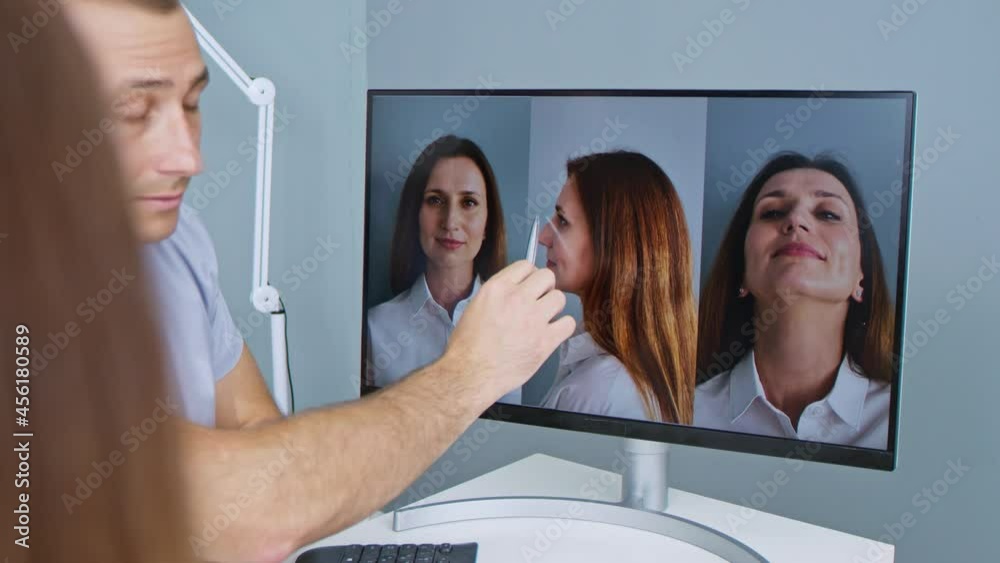 Plastic surgeon consulting woman about facial lift surgery, while ...