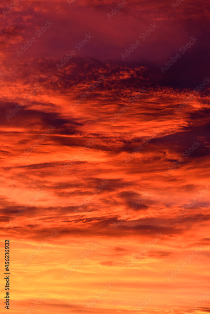 Beautiful, dramatic fiery orange sky and clouds after the sunset ...
