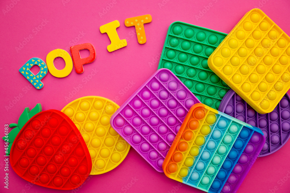 Sensory fidget toy "Pop-it". Instrument for fine motoric skils, tool to ...