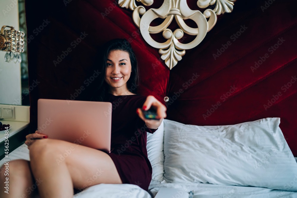 Portrait of cheerful Asian IT professional with digital laptop computer ...