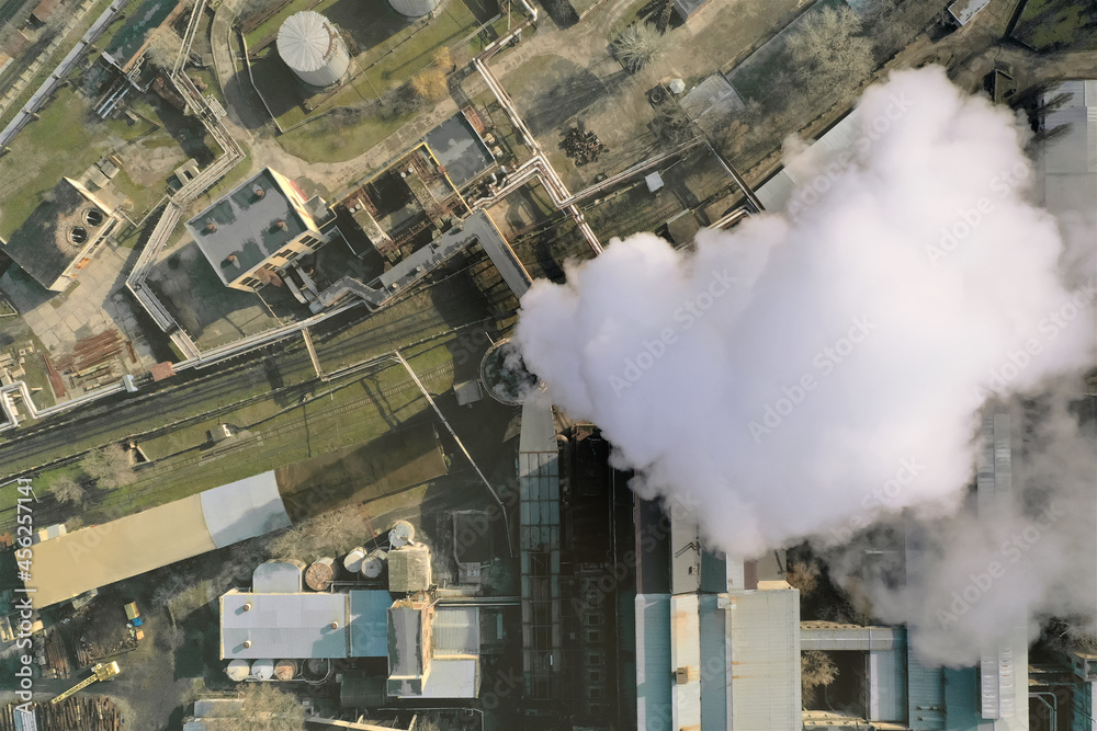Polluting air with smoke, aerial view of industrial factory. CO2 ...